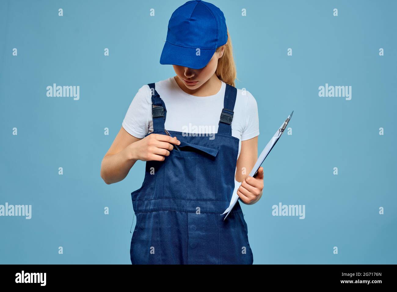 woman in construction uniform blue service professional cap Stock Photo ...