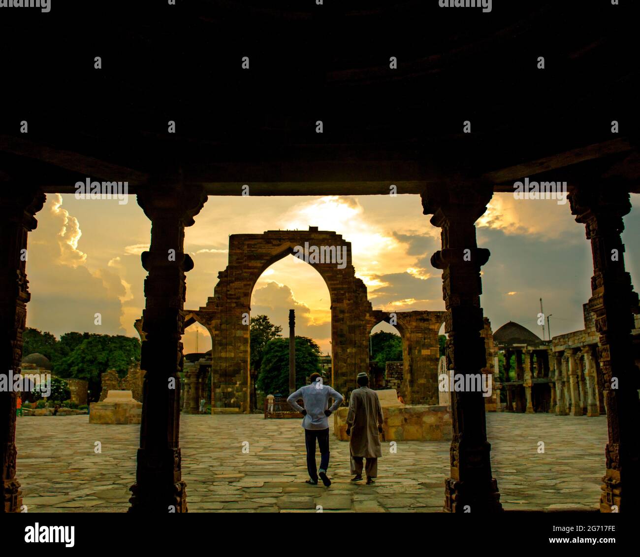 Two muslim man walking Stock Photo - Alamy