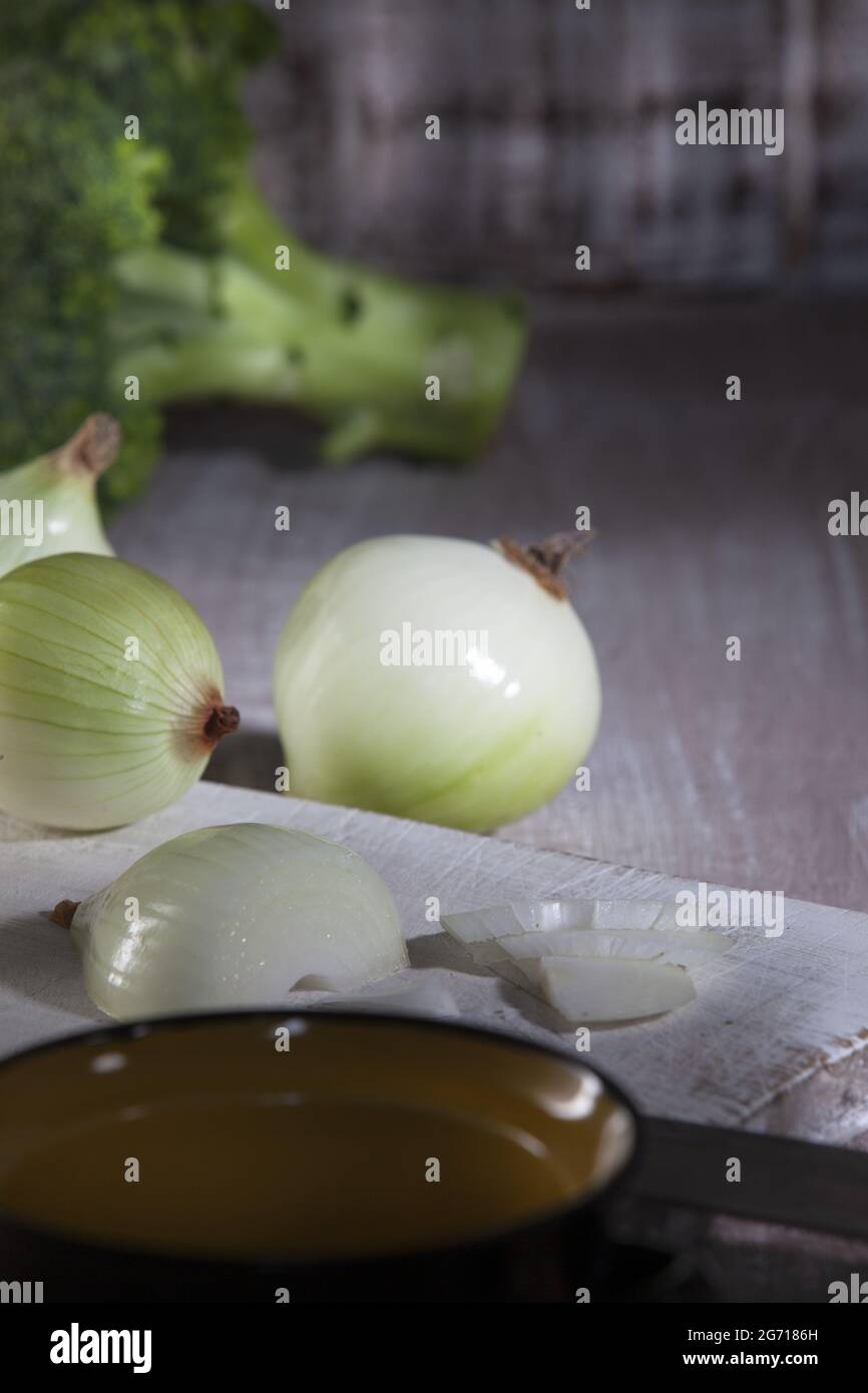 Closeup of peeled onions on the kitchen table ready for cooking Stock ...
