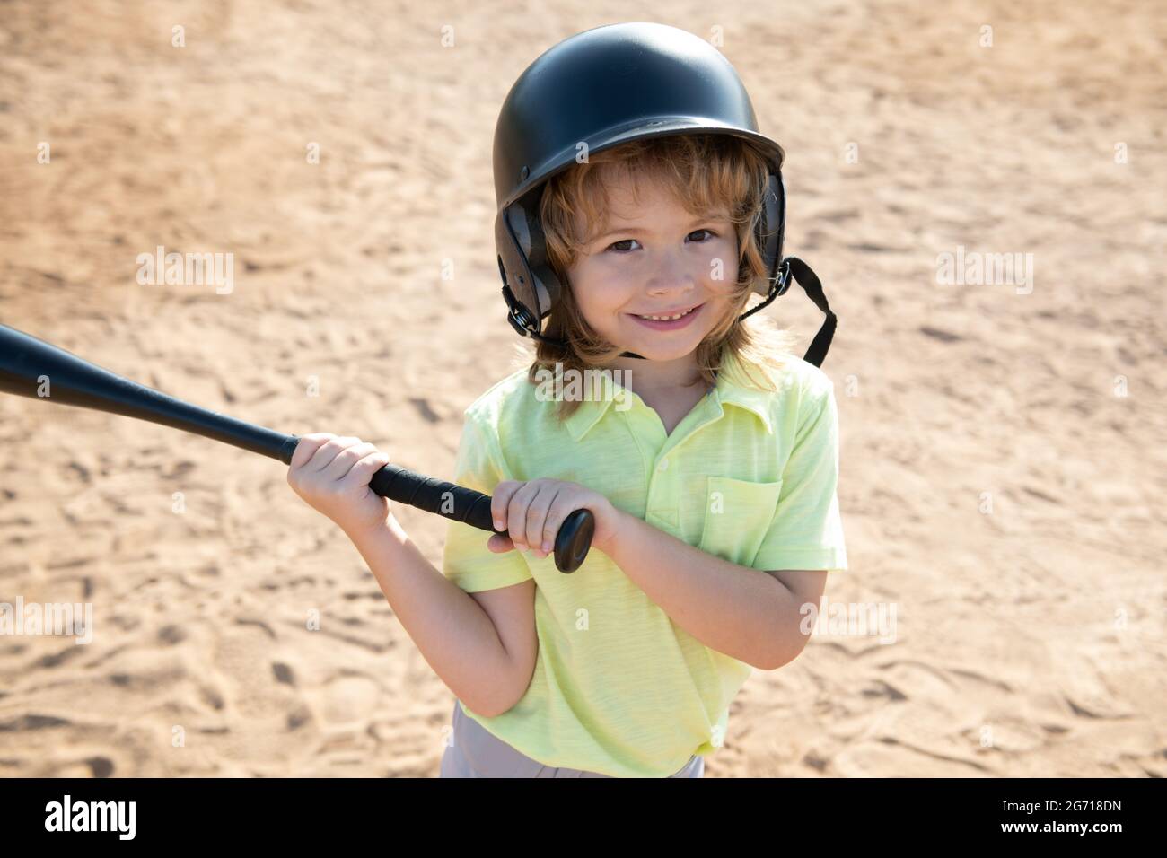 Kid holding a baseball bat. Pitcher child about to throw in youth ...