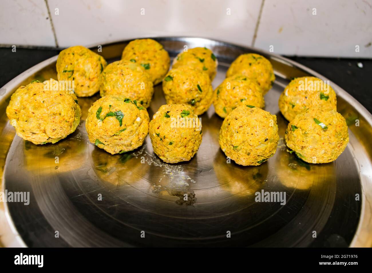 Vegetarian Kopta ready for frying kept on a plate after made in ...