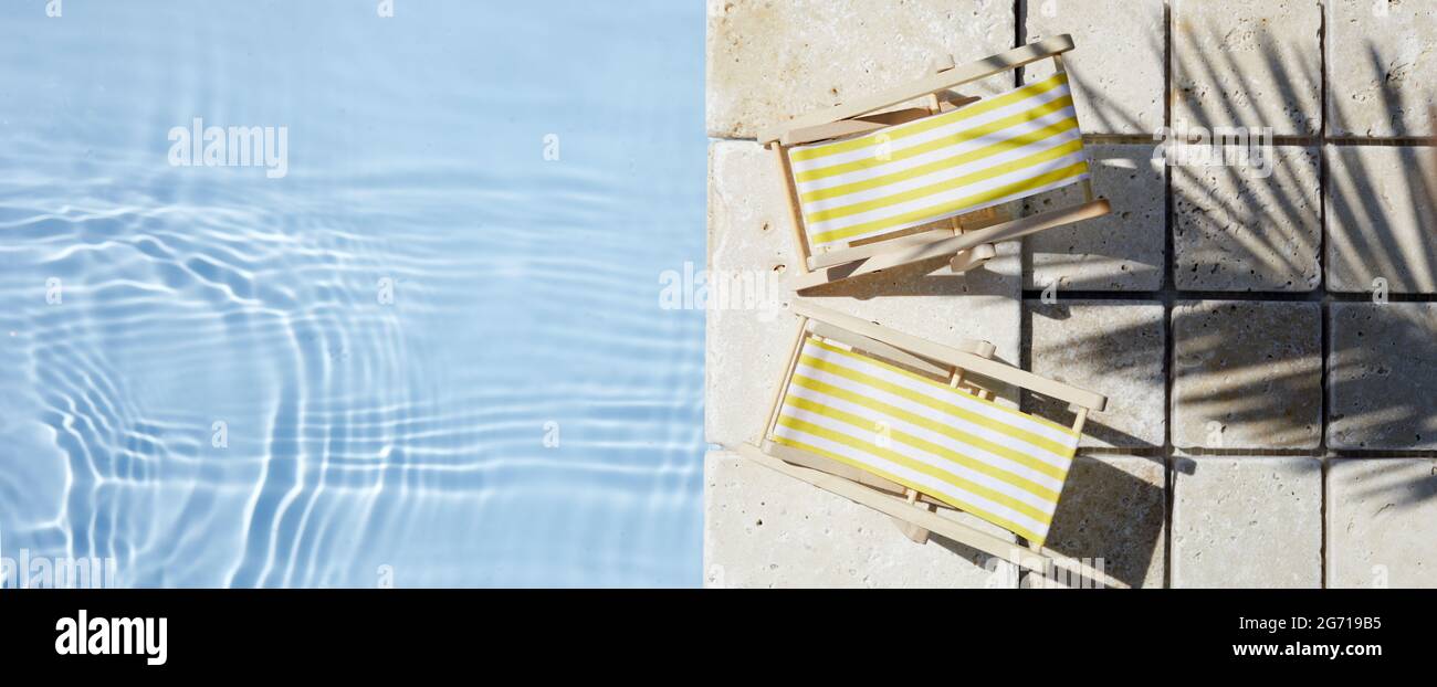 Swimming pool and empty resting chair with shadow. Top view Stock Photo ...