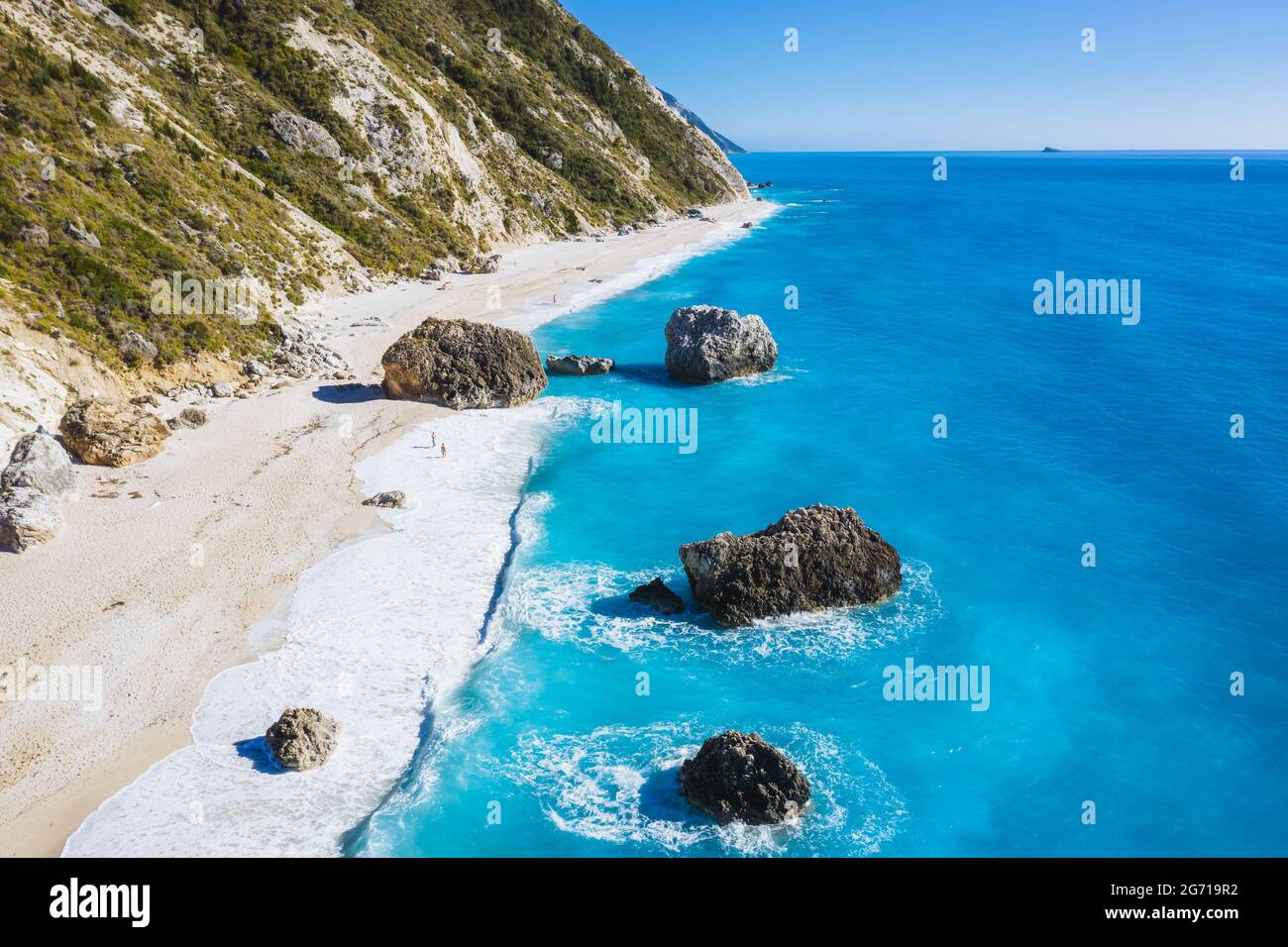 Aerial view of Kalamitsi beach with big boulders in turquoise blue ...