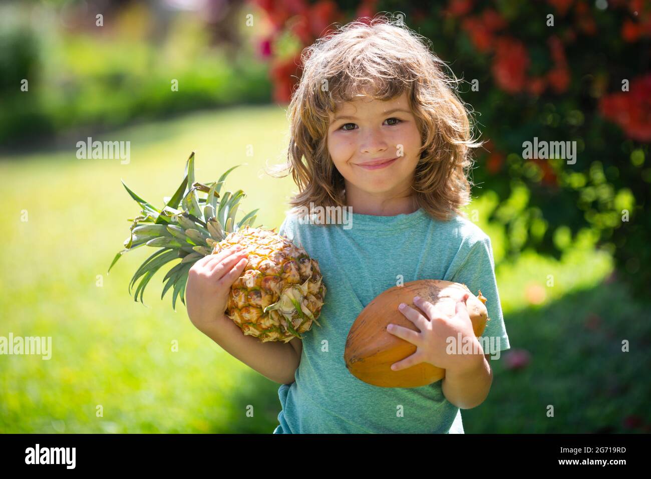 Child with pineapple and coconut. Kid with tropical fruit. Exotic ...