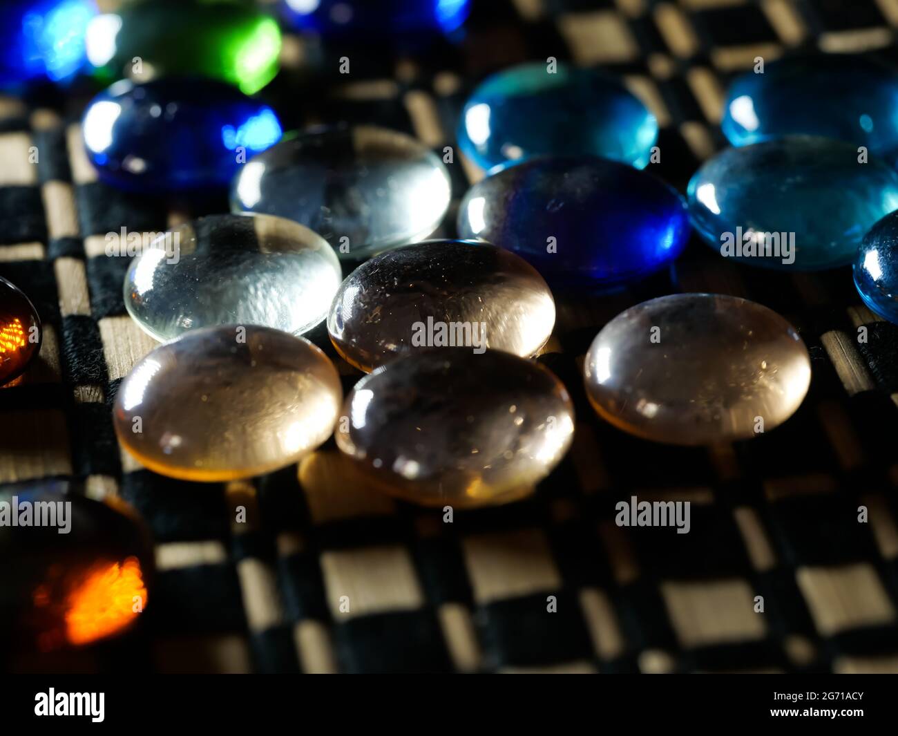 Closeup of different colored circular game board tokens on a fun ...