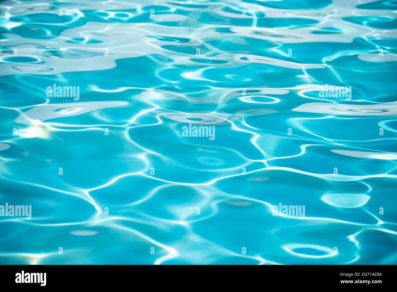 Ripple Water in swimming pool with sun reflection. Wavy water ...
