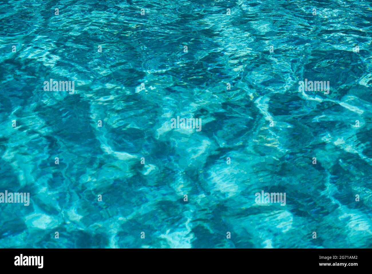 Ripple Water in swimming pool with sun reflection. Wavy water ...