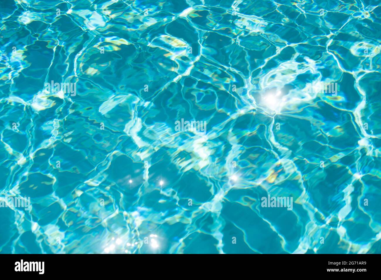 Abstract ripple wave and clear turquoise water surface in swimming pool ...