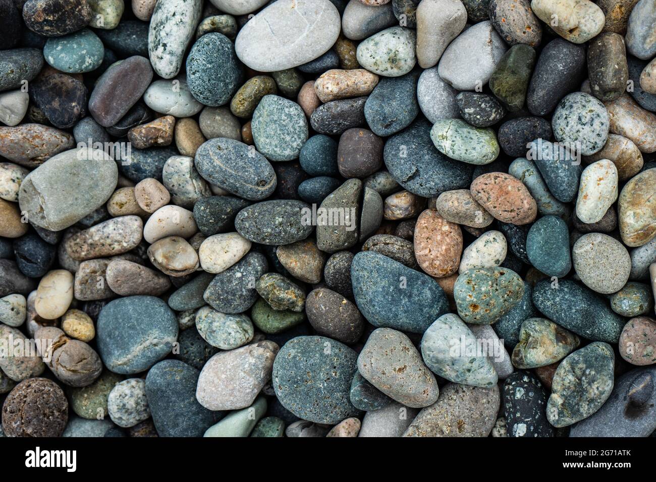 Beach sea stones as a natural textured background Stock Photo - Alamy