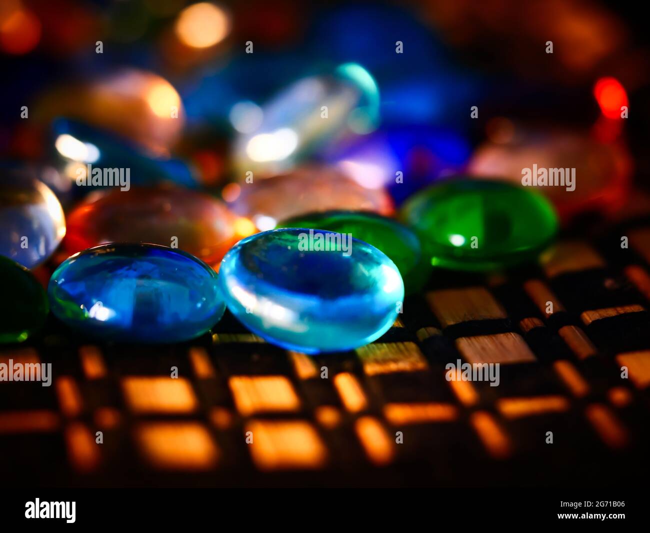 Closeup of bright colorful board game tokens on a checkered board with ...