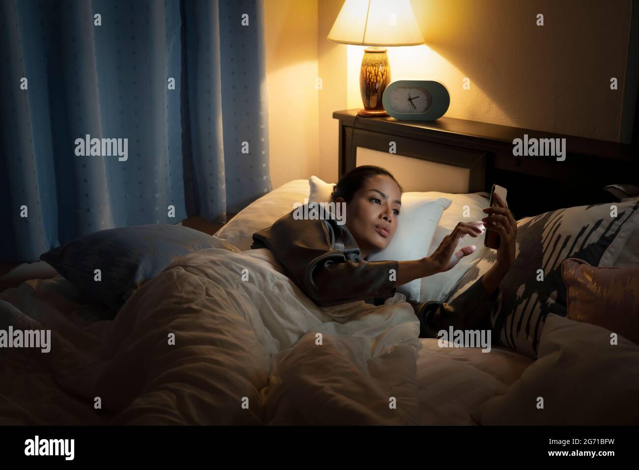 woman people in robe using smart cellphone.Sad Depressed Insomnia girl ...