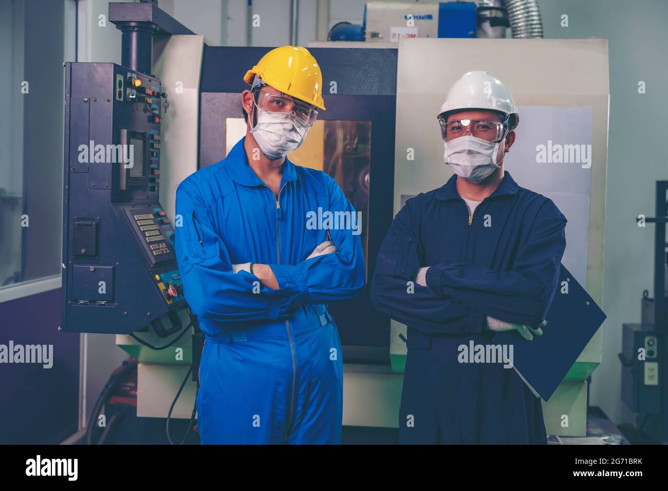 Male industrial engineer or technician worker wear face mask with ...