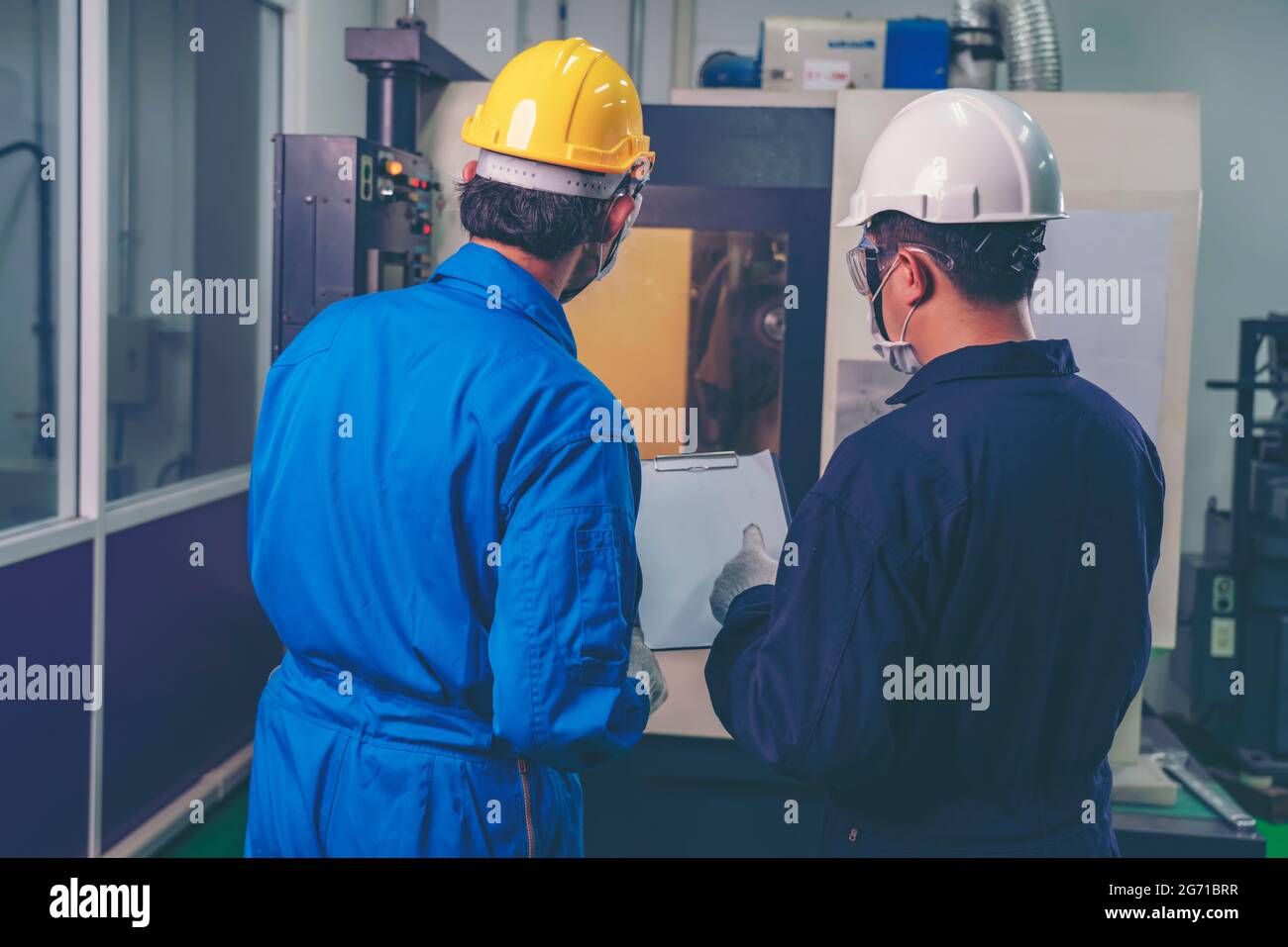 Male industrial engineer or technician worker wear face mask with ...