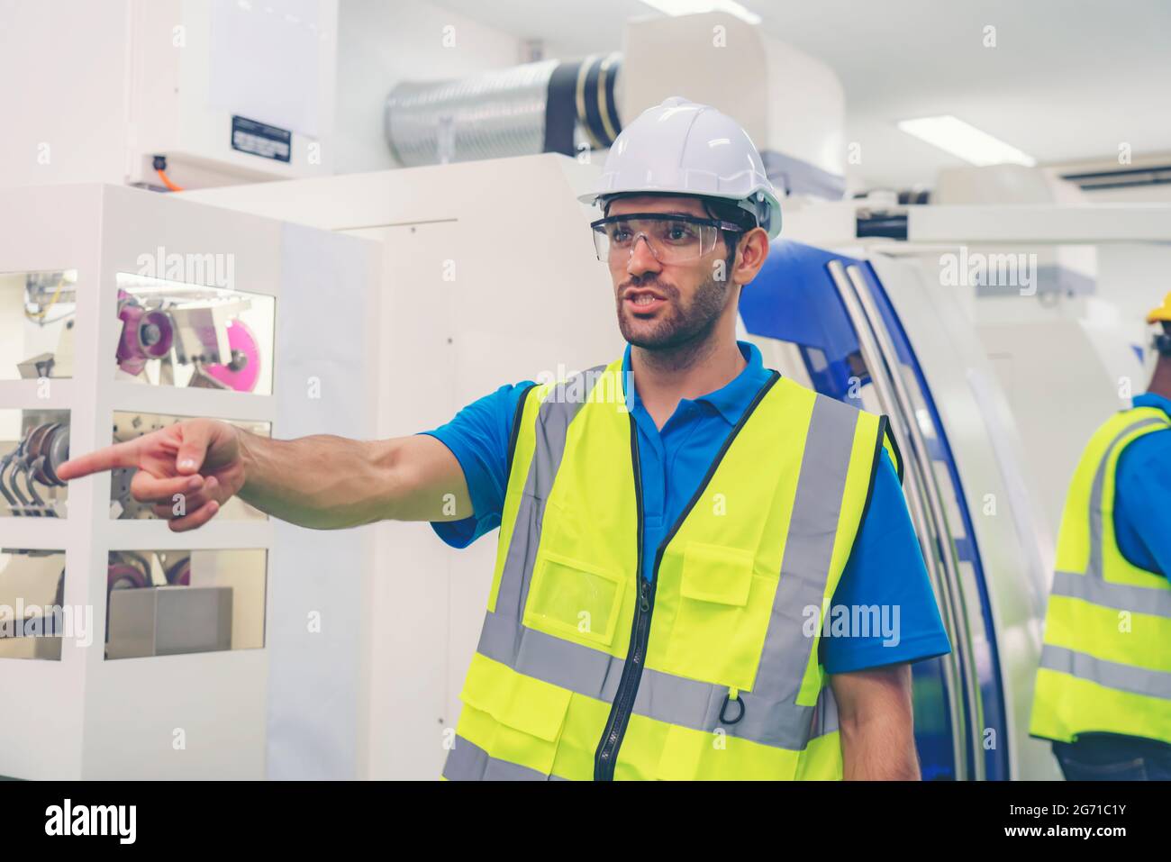 Male industrial engineer or technician worker wear face mask with ...