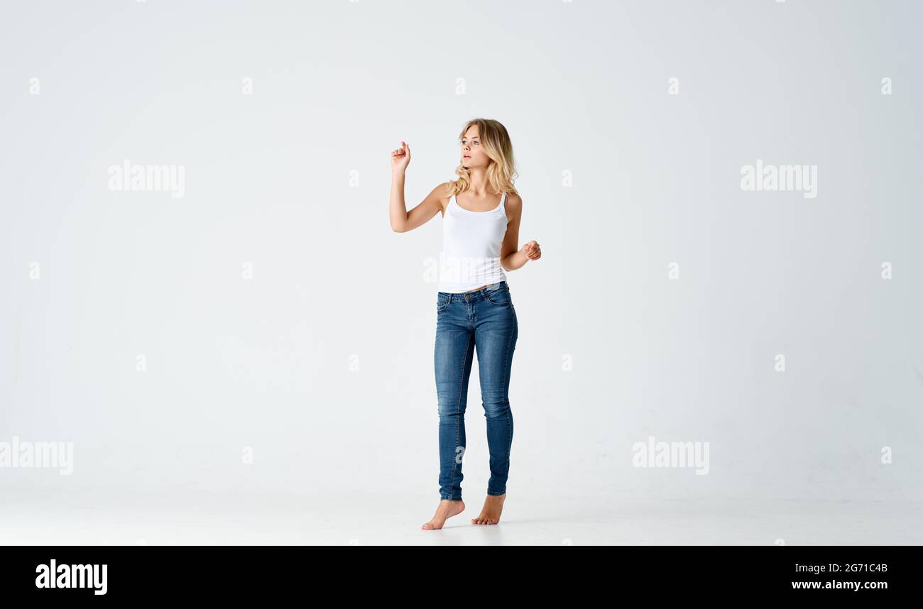 woman barefoot on turns posing motion model Stock Photo - Alamy