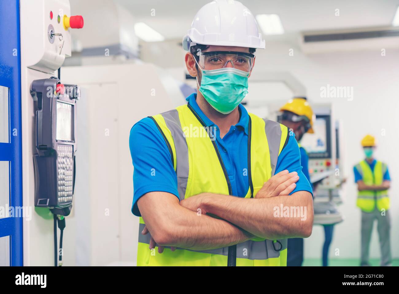 Male industrial engineer or technician worker wear face mask with ...