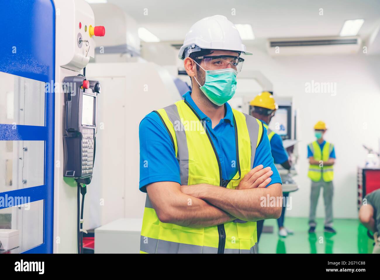 Male industrial engineer or technician worker wear face mask with ...