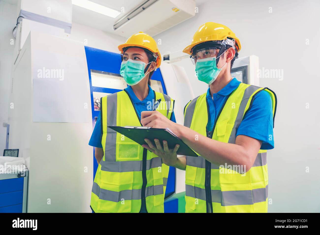Male industrial engineer or technician worker wear face mask with ...
