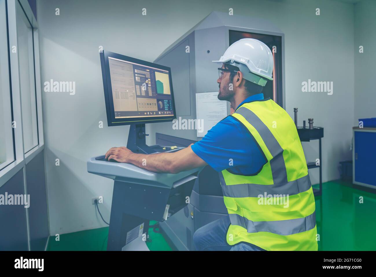 Male industrial engineer or technician worker wear face mask with ...