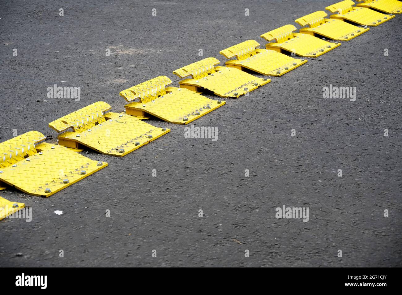 Yellow flow traffic control plates for one way direction of cars Stock ...