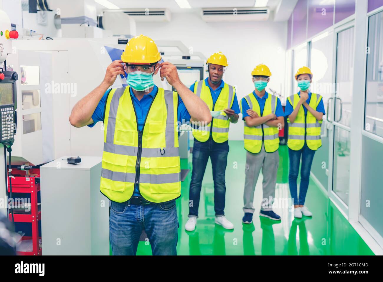 Male industrial engineer or technician worker wear face mask with ...