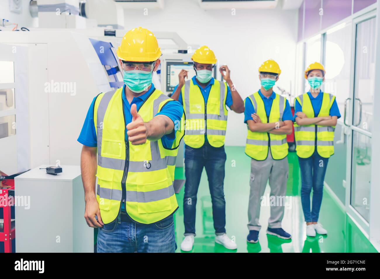 Male industrial engineer or technician worker wear face mask with ...