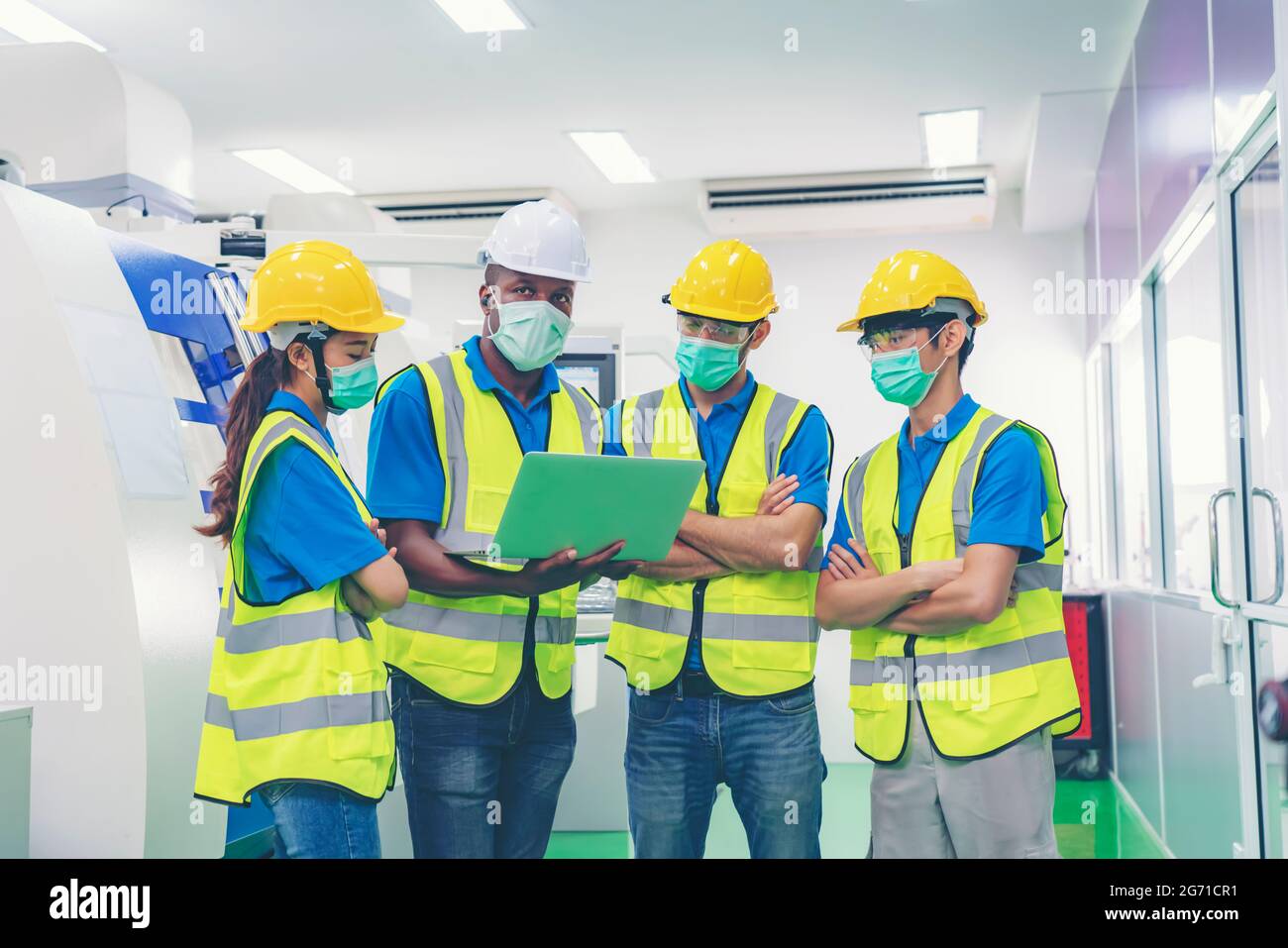 Male industrial engineer or technician worker wear face mask with ...