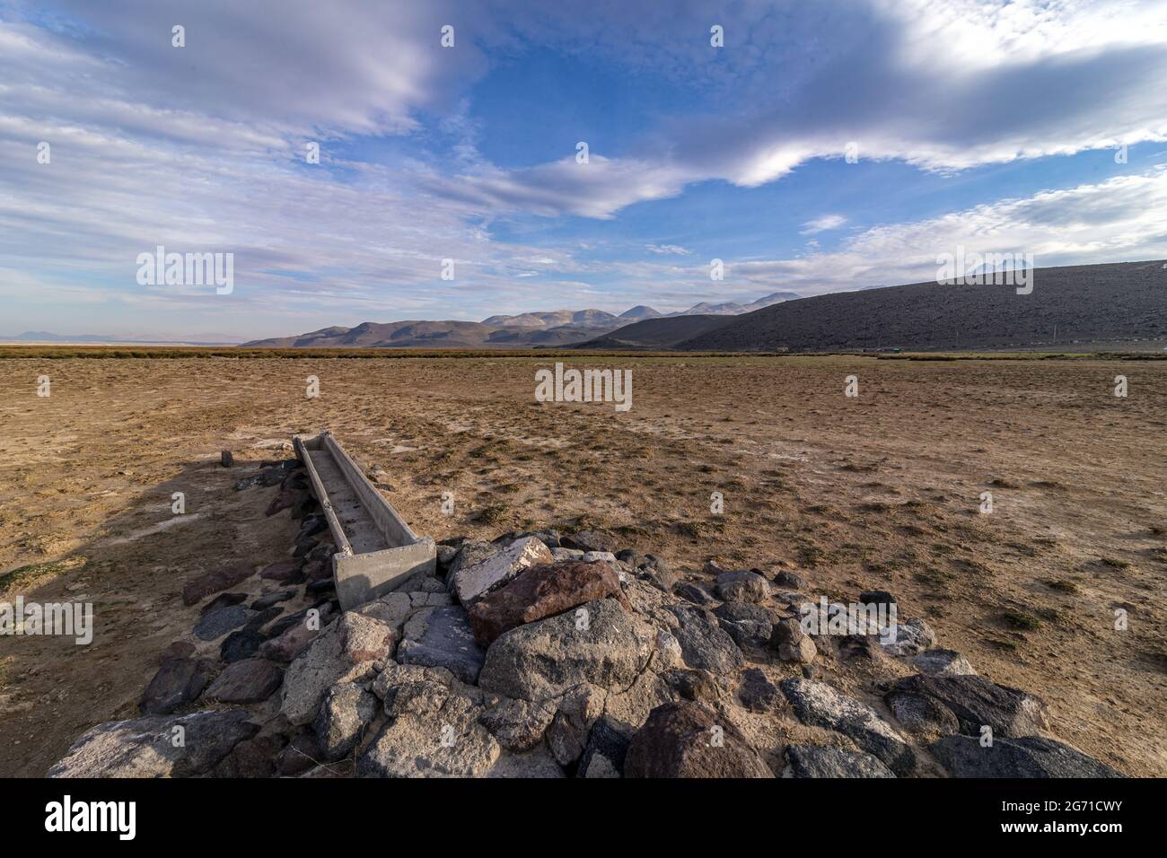 Global warming concept - an empty trough in a dry deserted field Stock ...