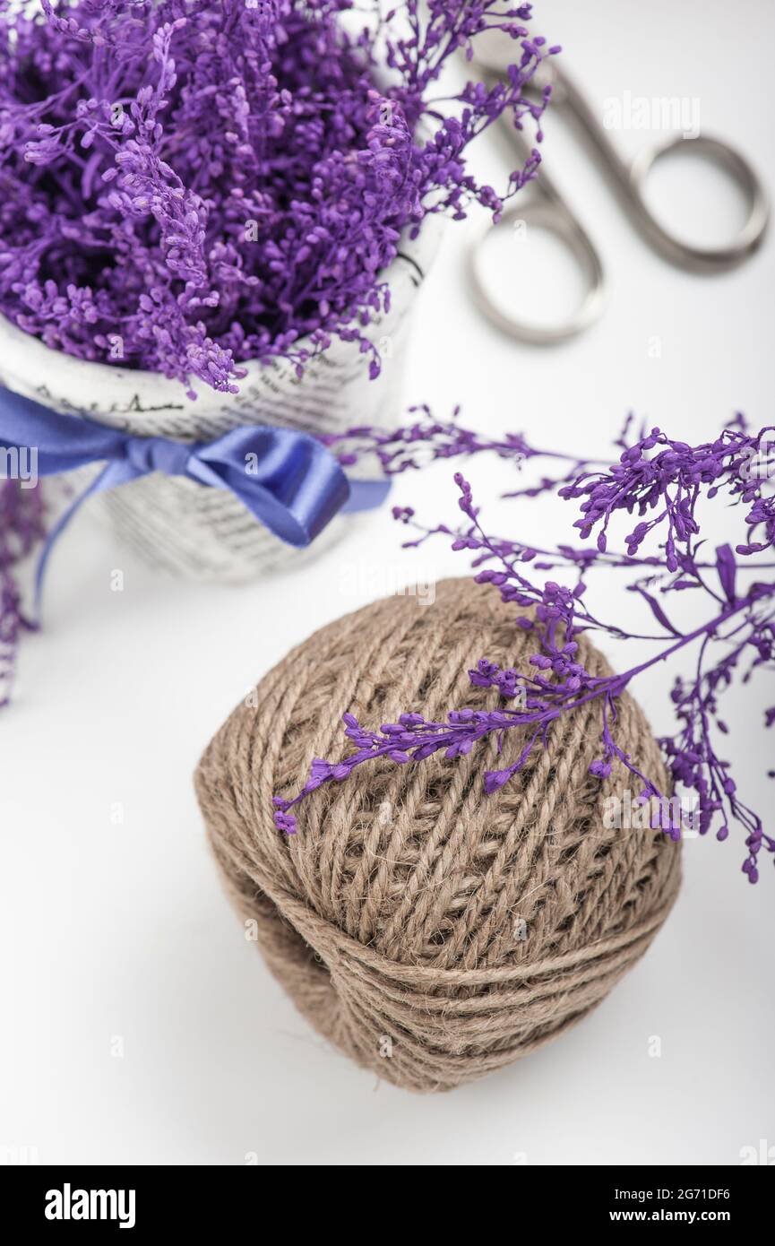 Twine and purple branches in the pot. Gardening decoration. Vintage ...