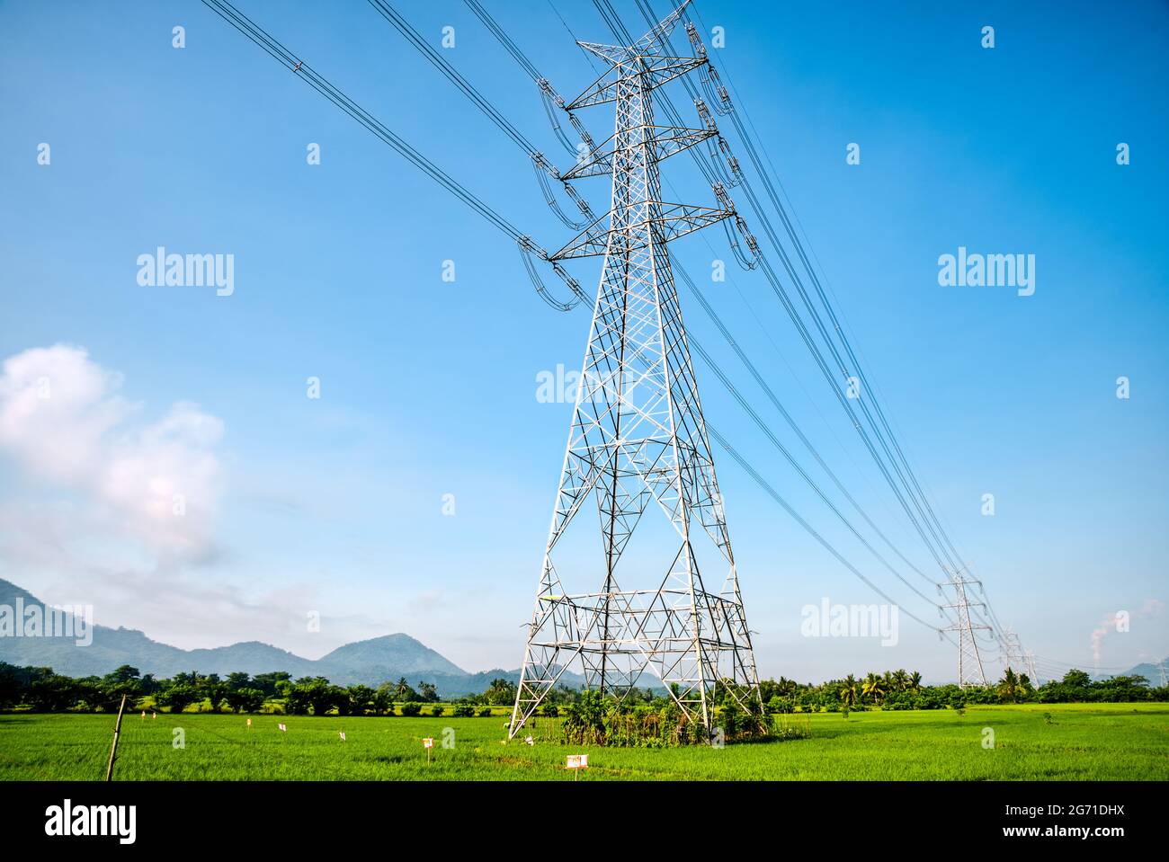 Overhead eletrical transmission line crossing the rice field at ...