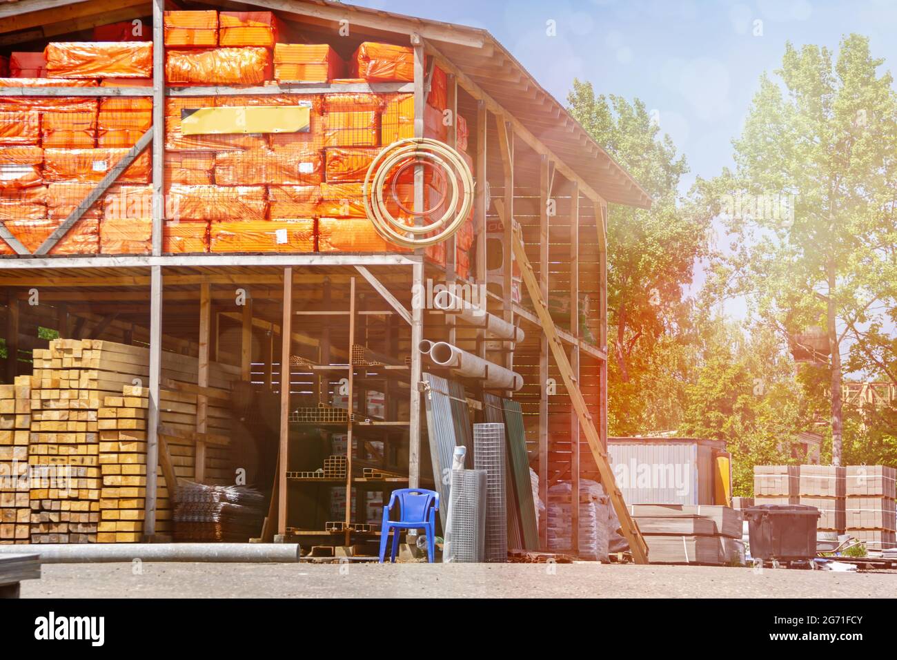 Building materials in the hardware store. Wooden boards, bags of cement ...