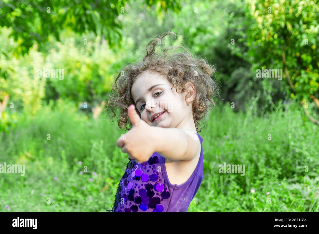 child in the grass, little pterry girl in the garden, child in the park ...