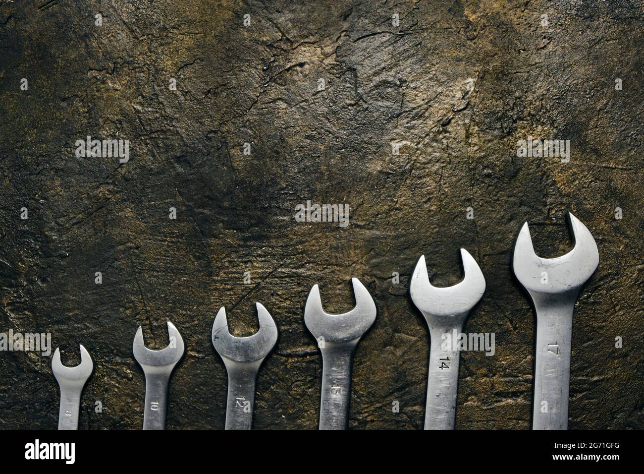 Set of wrenches on a concrete background Stock Photo - Alamy