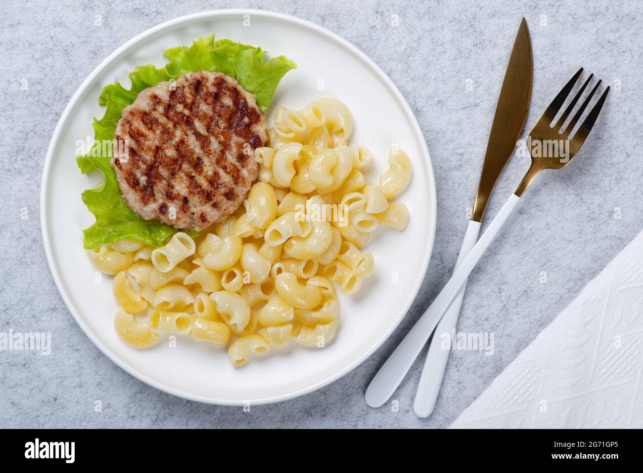 Chicken cutlet with pasta. Top view Stock Photo - Alamy