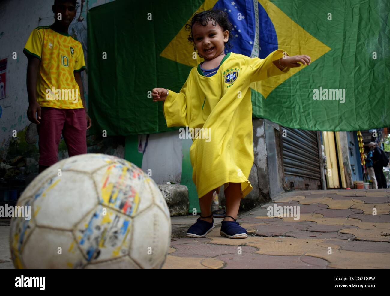 Kolkata, India. 10th July, 2021. A toddler wearing Brazil football ...