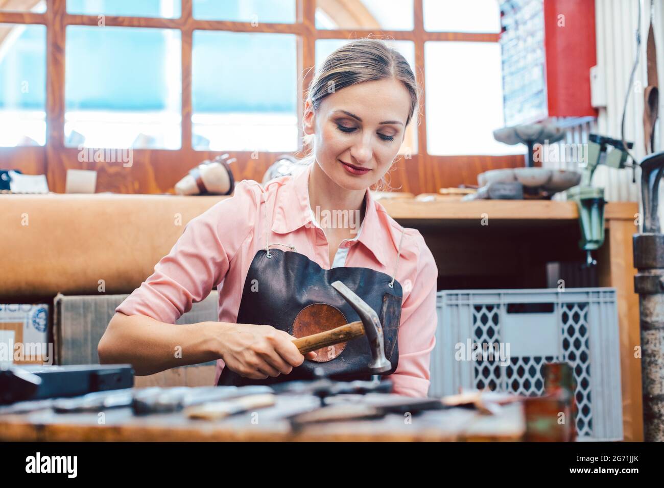 Shoemaker fixing shoes hi-res stock photography and images - Alamy