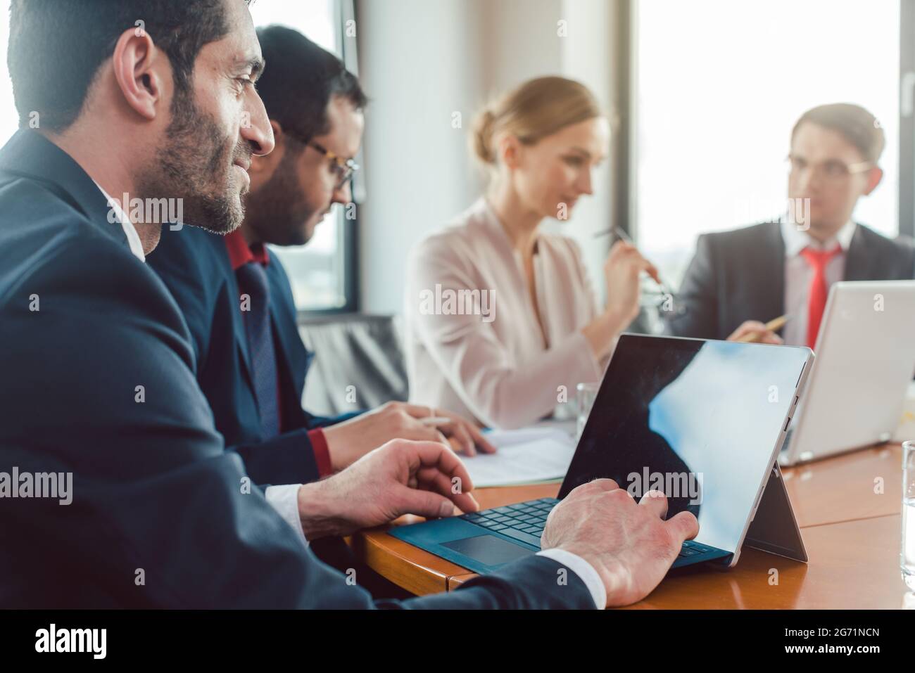 Office business team working in a meeting writing documents Stock Photo ...