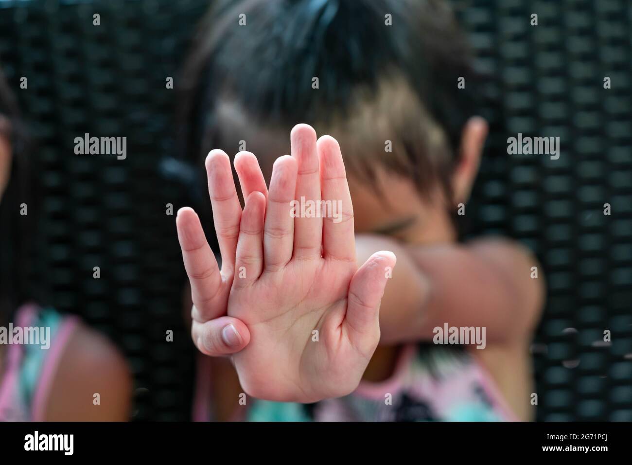 Female child showing palm of hand saying no. Child saying no to camera ...