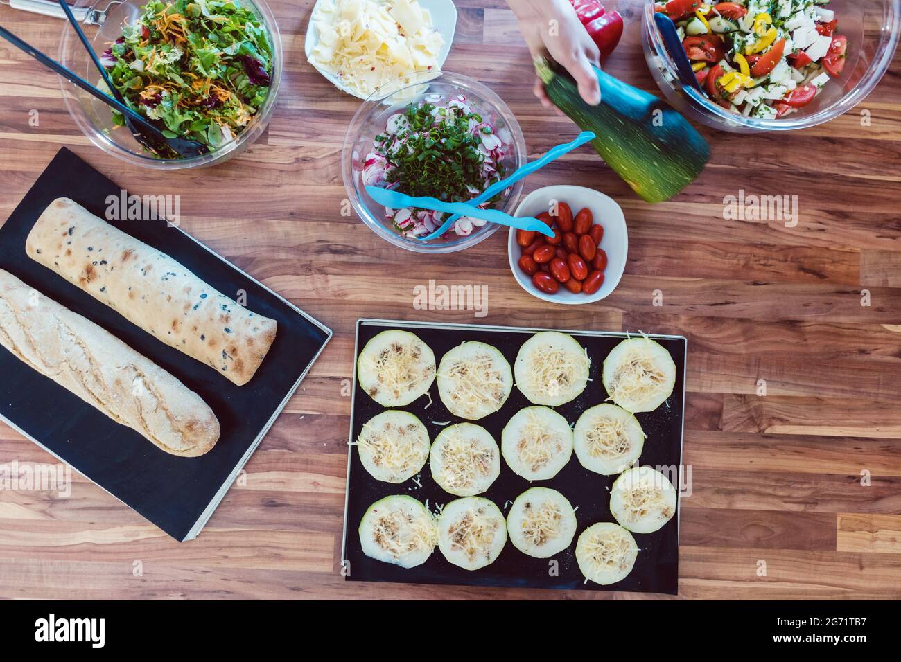 Salads and dishes on kitchen counter waiting to be fetched Stock Photo ...