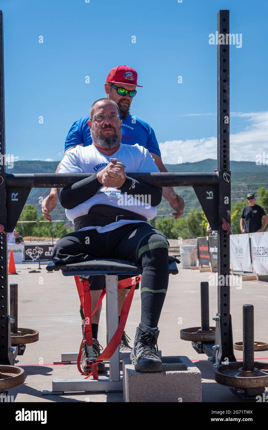 A weightlifter with a disability competes as an adaptive athlete in the ...