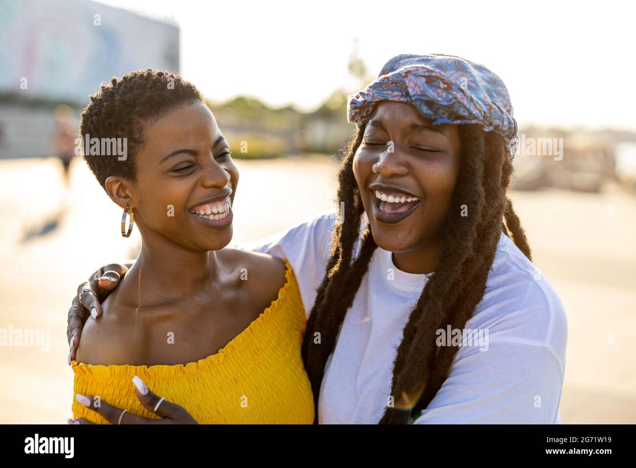 Two girlfriends having fun outdoors Stock Photo - Alamy