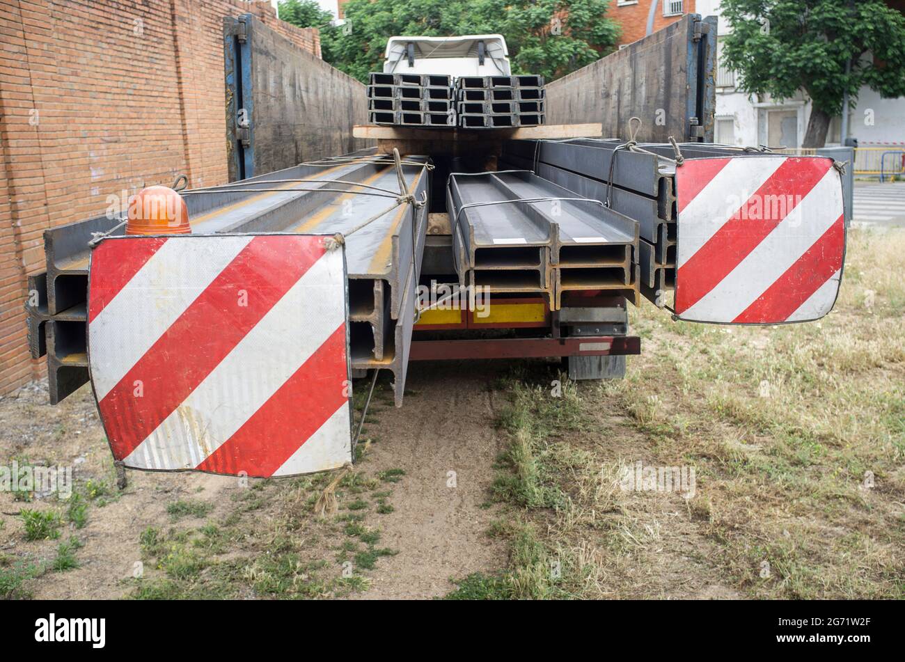Building materials truck loaded with steel beams. Oversize load length ...