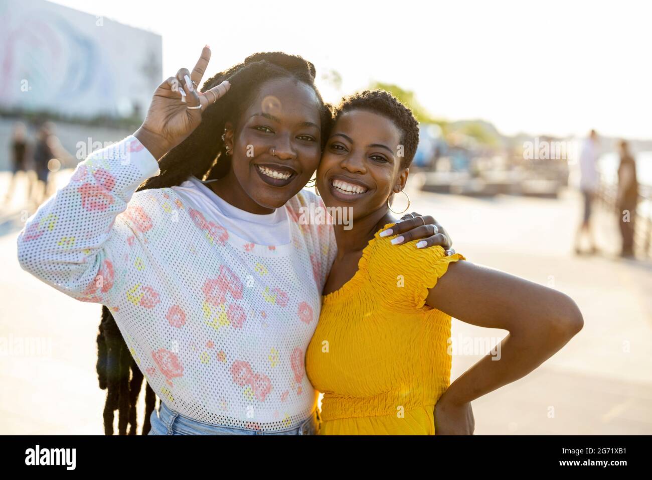Two girlfriends having fun outdoors Stock Photo - Alamy