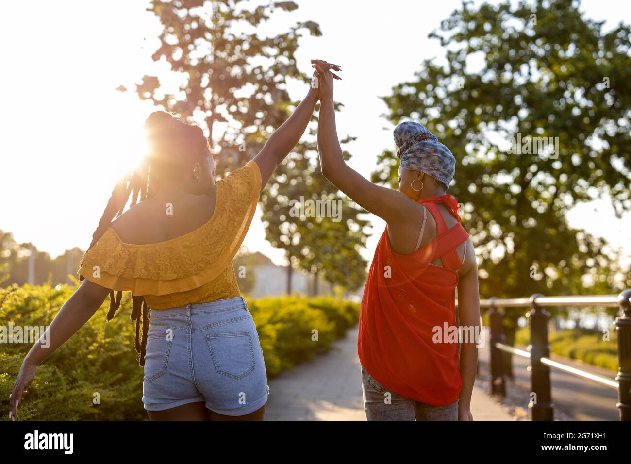 Two girlfriends having fun outdoors Stock Photo - Alamy