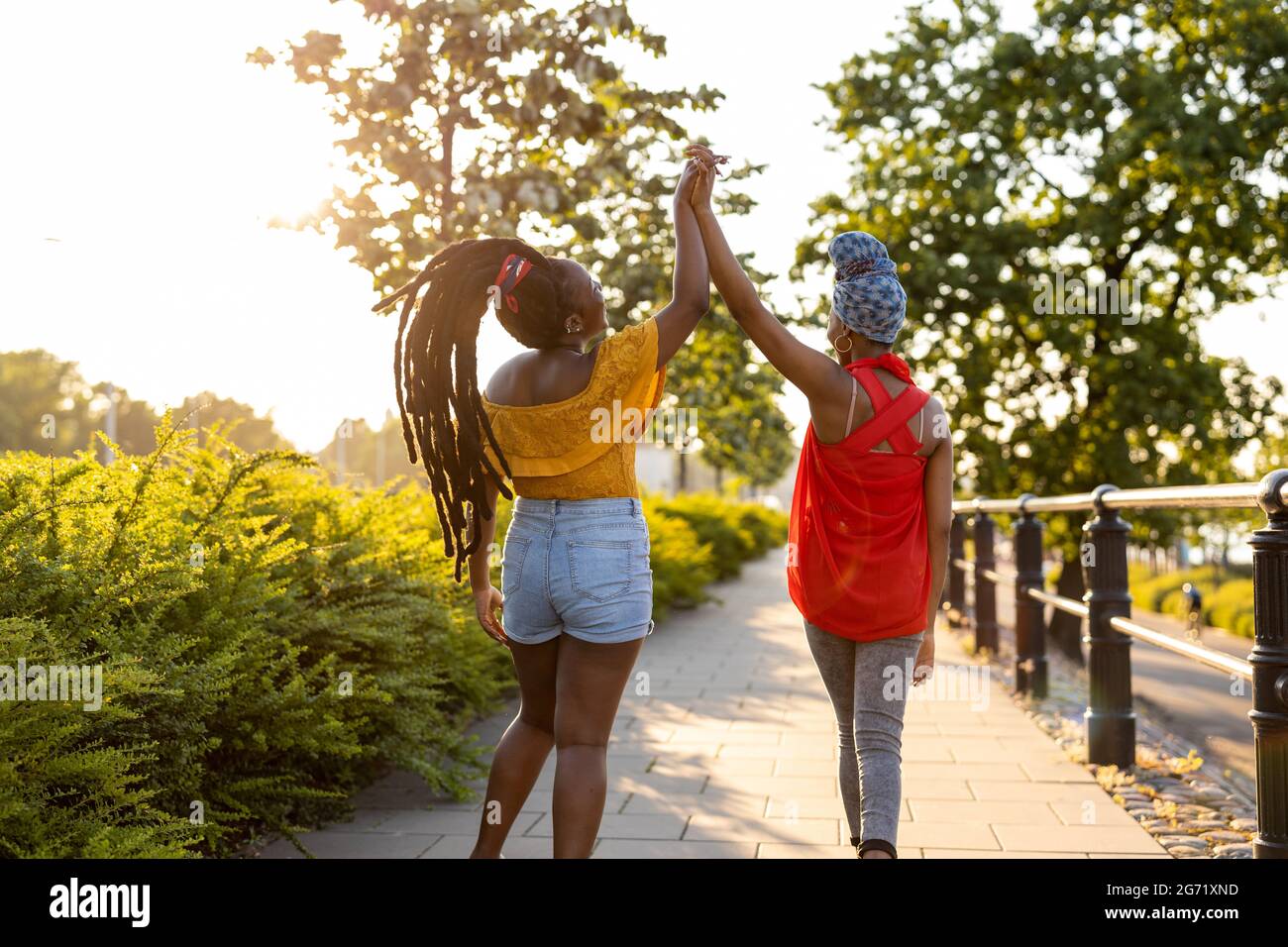 Two girlfriends having fun outdoors Stock Photo - Alamy