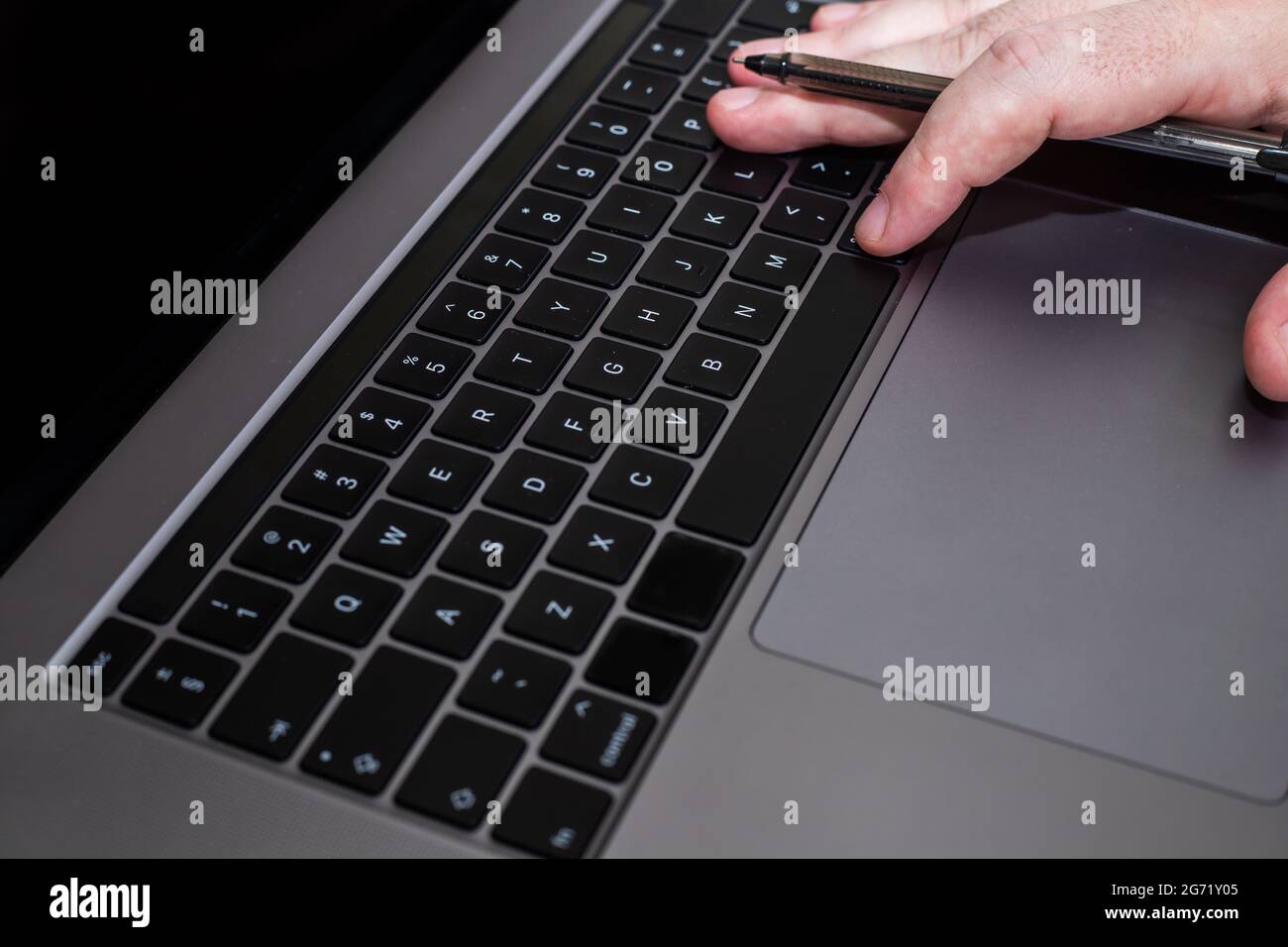 Hands Pressing Computer Keyboard Keys While Writing With Pencil In ...