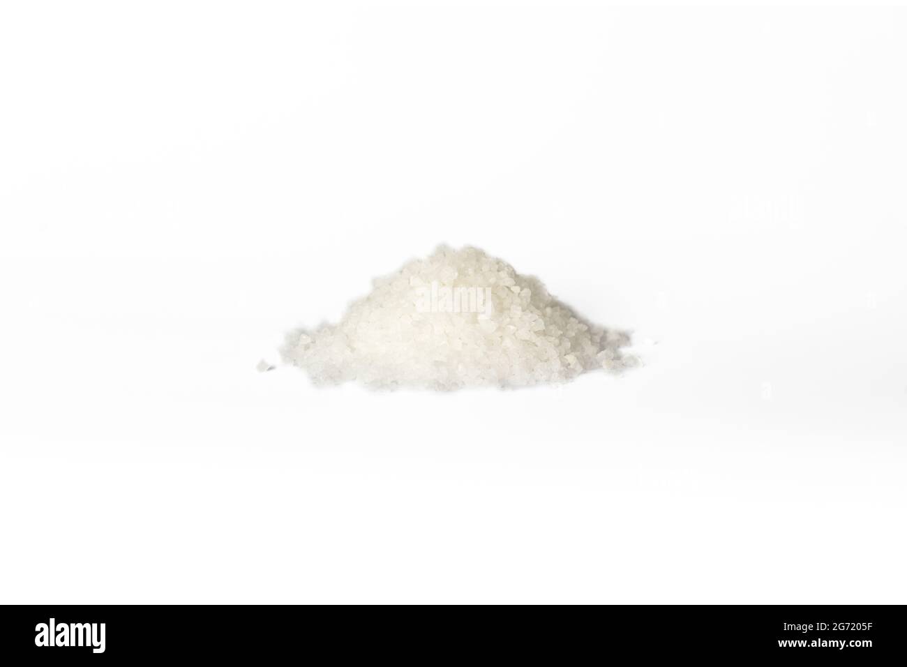 Closeup of a pile of sodium hydroxide isolated on a white background ...