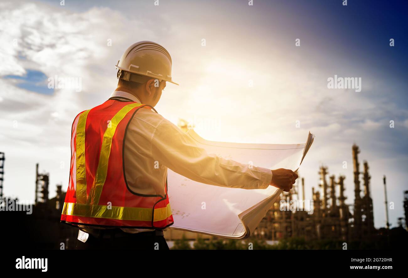 Engineer worker Concept working at oil refinery. Young Asian men worker ...