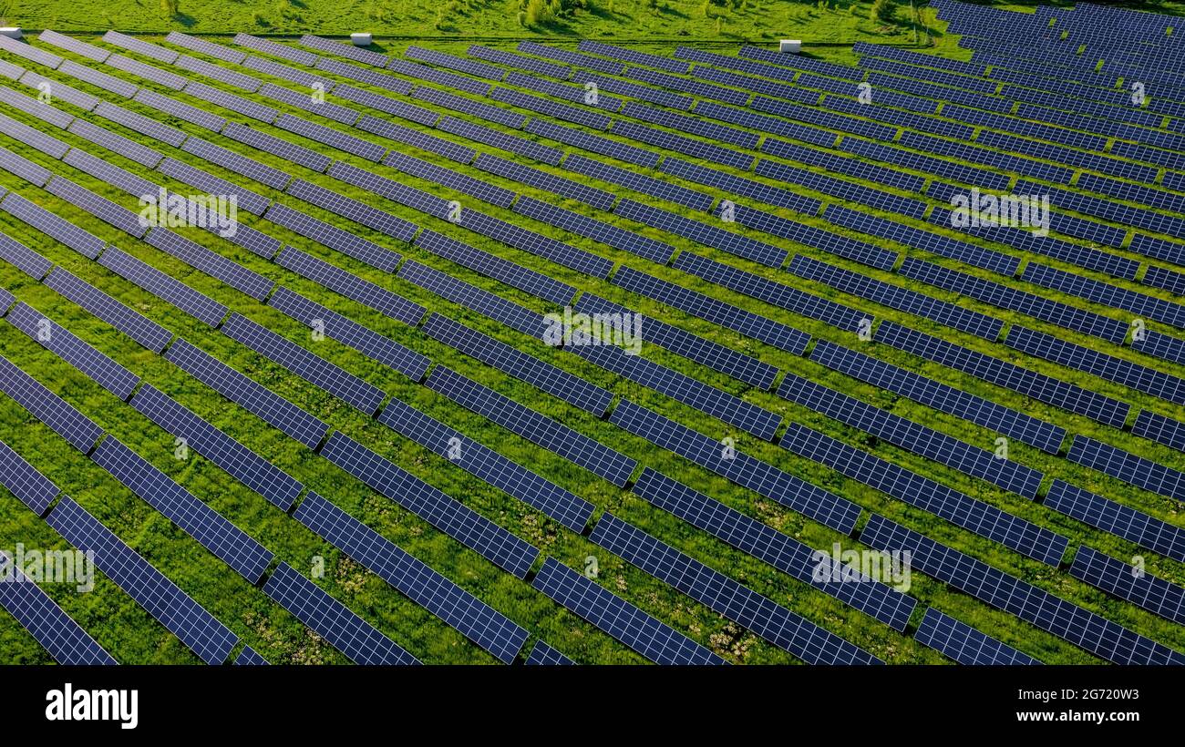 Ecology solar power station panels in the fields green energy at sunset ...