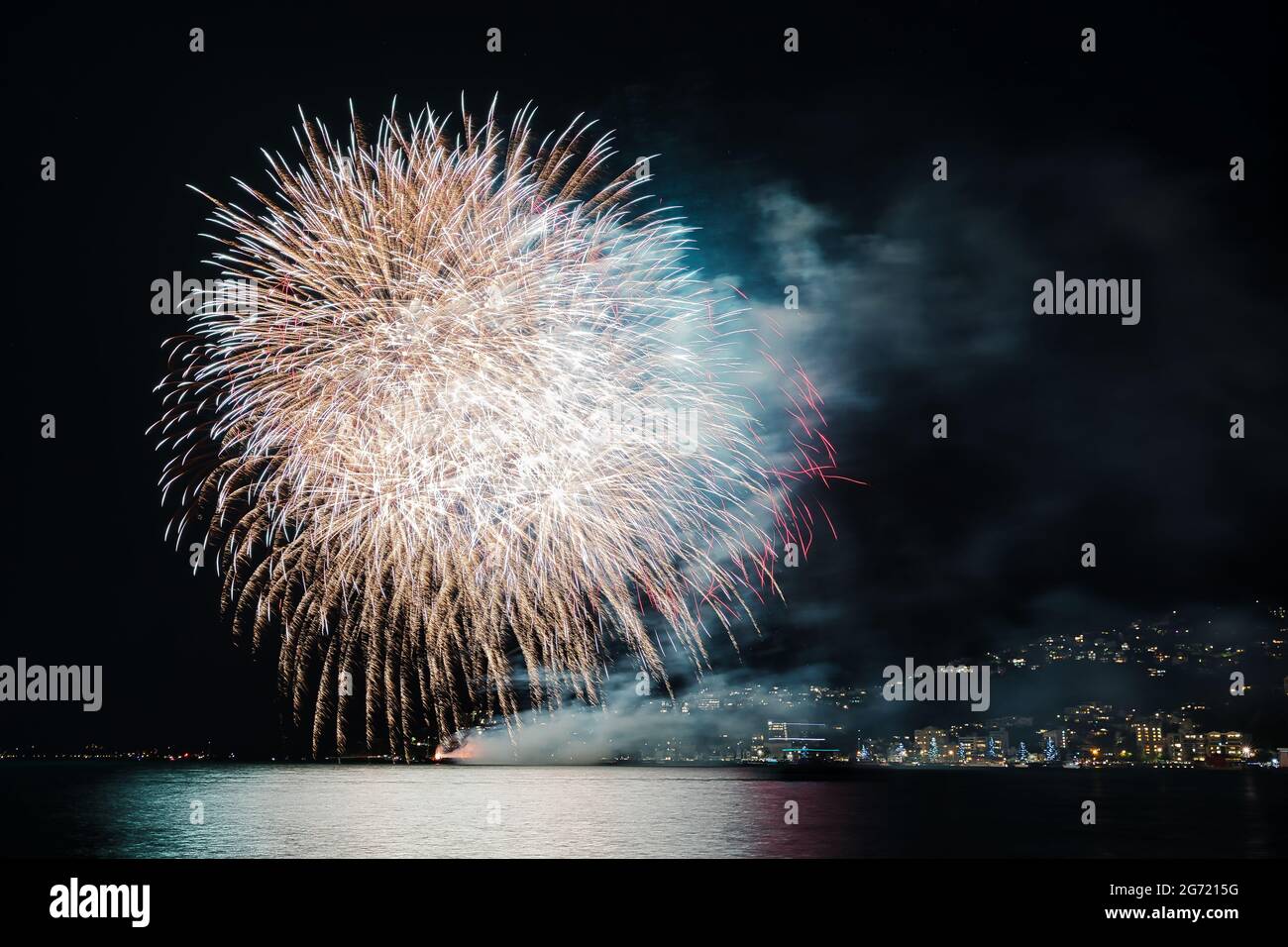 Wellington, New Zealand. 10th July, 2021. Fireworks light up the sky to ...